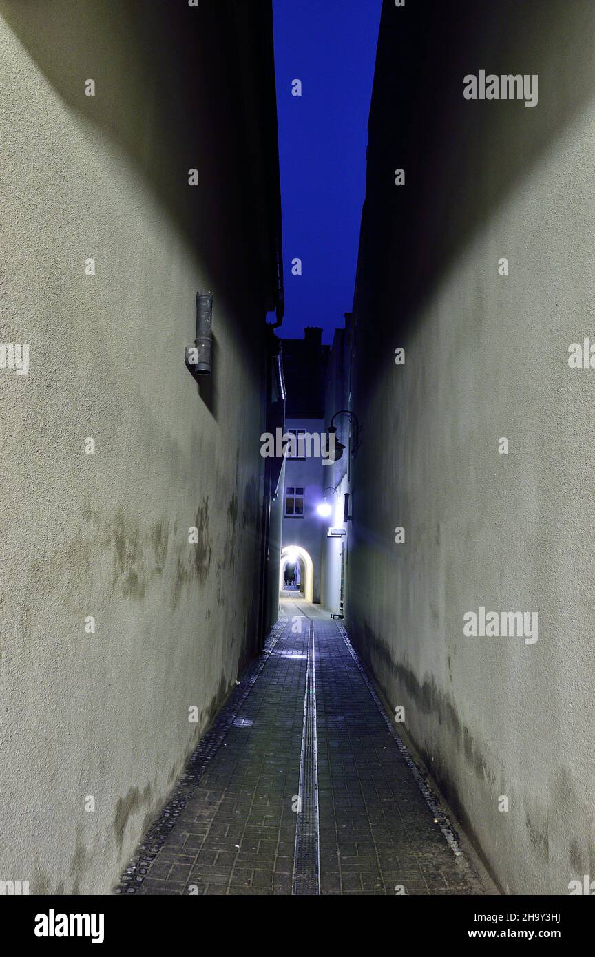 A narrow passage and an illuminating lamp in the narrow passage between ...