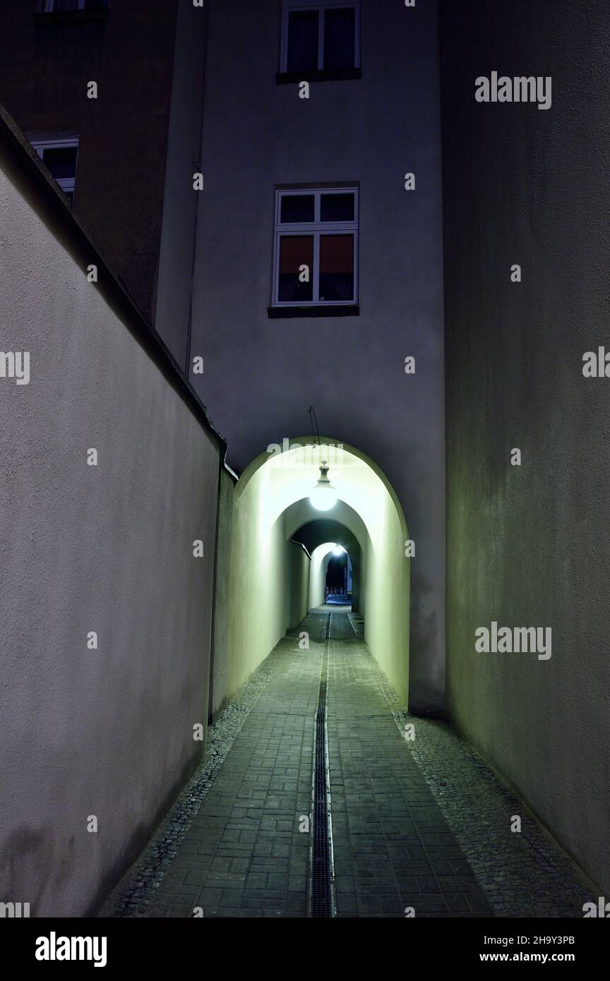 A narrow passage and an illuminating lamp in the narrow passage between ...