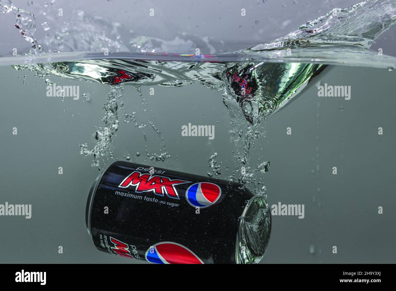 Close up view of can of Pepsi cola falling into water isolation on ...