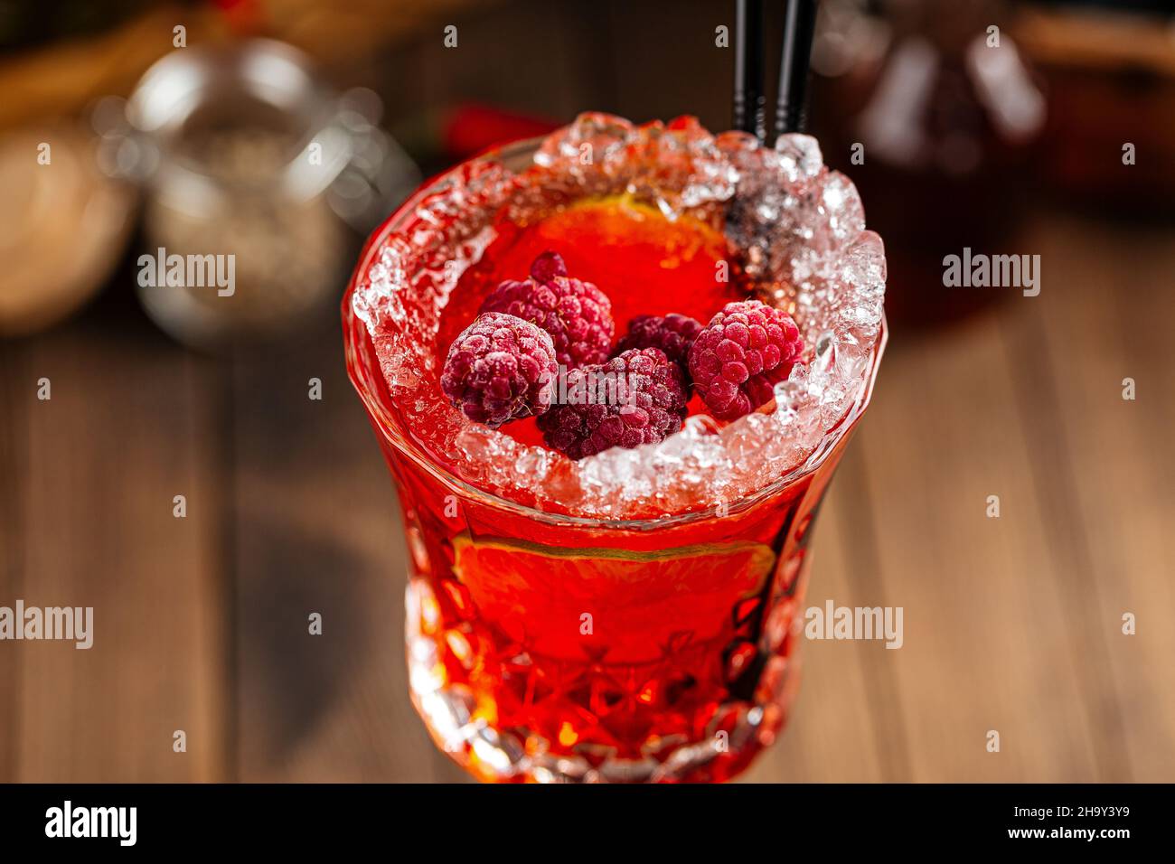 Sweet red berry alcohol cocktail in a fancy glass Stock Photo - Alamy