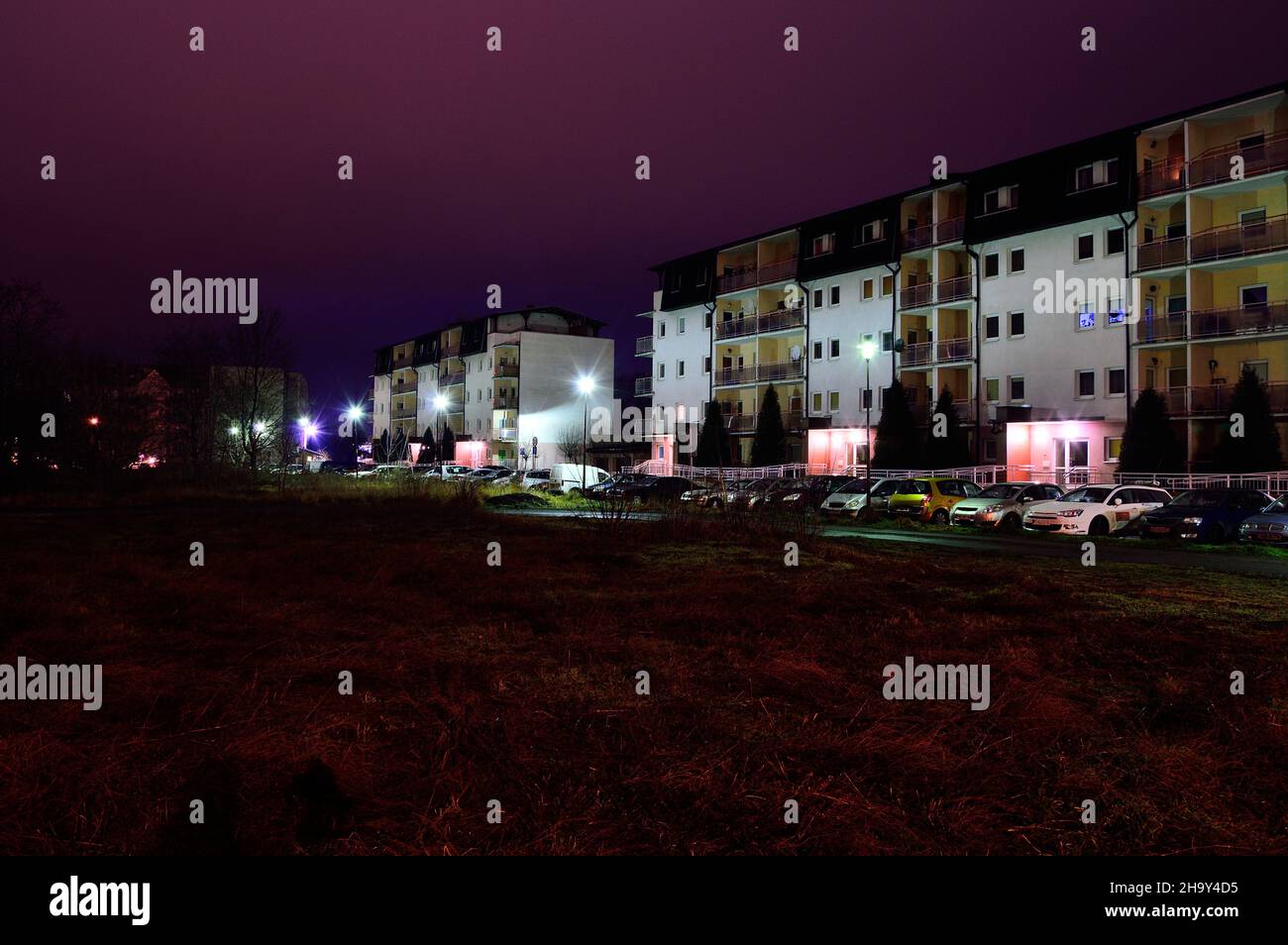 Houses and buildings illuminated with unusual light from lamps on a ...