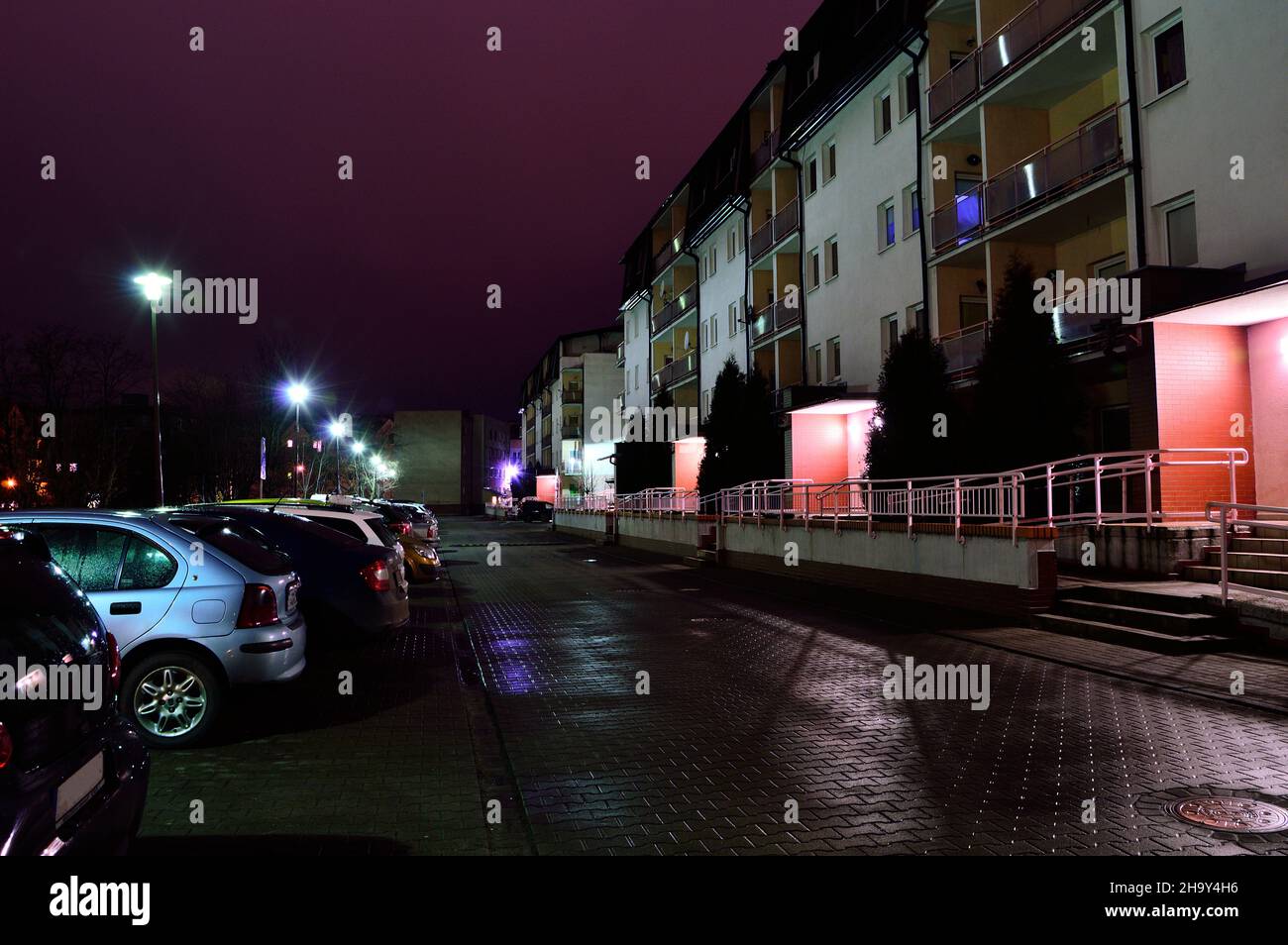 Houses and buildings illuminated with unusual light from lamps on a ...