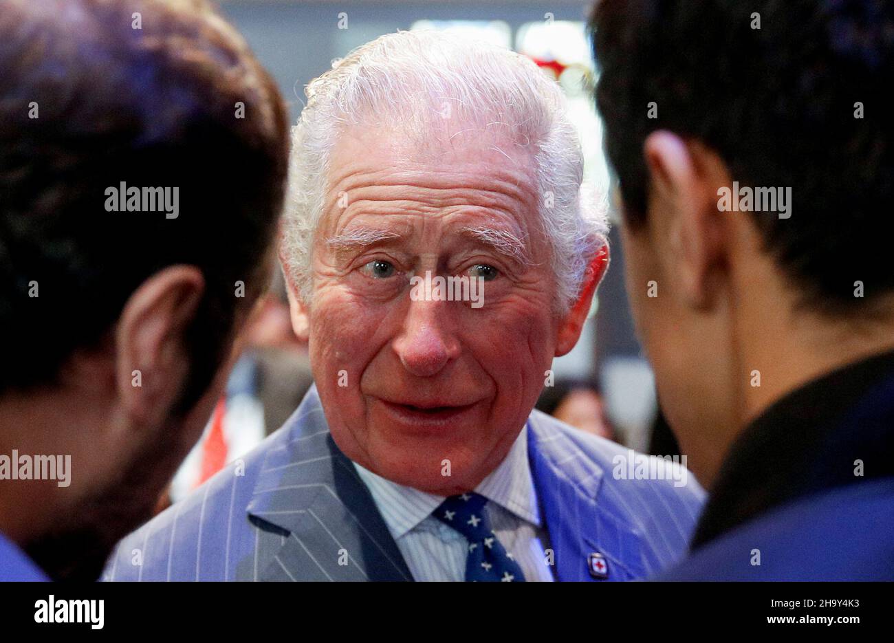The Prince of Wales speaks with former refugees during a visit to Holy ...