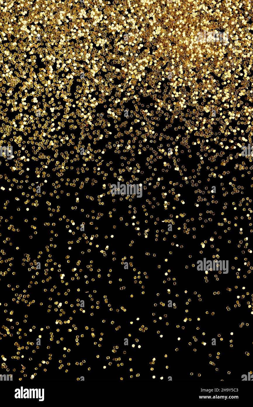 Gold glitter confetti background. Luxury New Year party celebration. Golden dust backdrop or ...