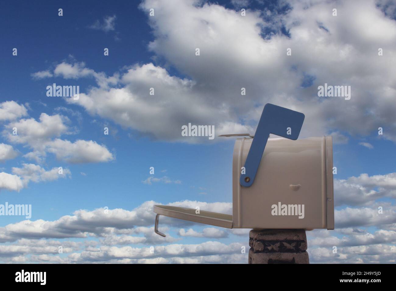 Open Mail Box With Flag up and Blue Sky Stock Photo - Alamy