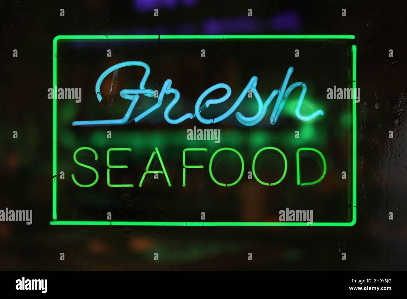 Vintage Neon Fresh Seafood Sign in Rainy Window Stock Photo - Alamy