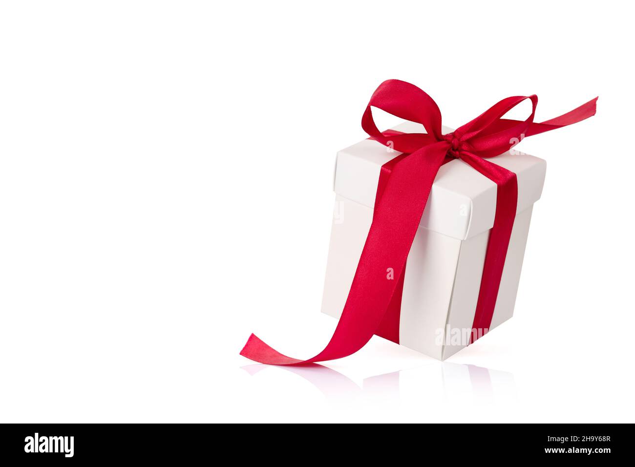 White gift box with red ribbon isolated on white background Stock Photo ...