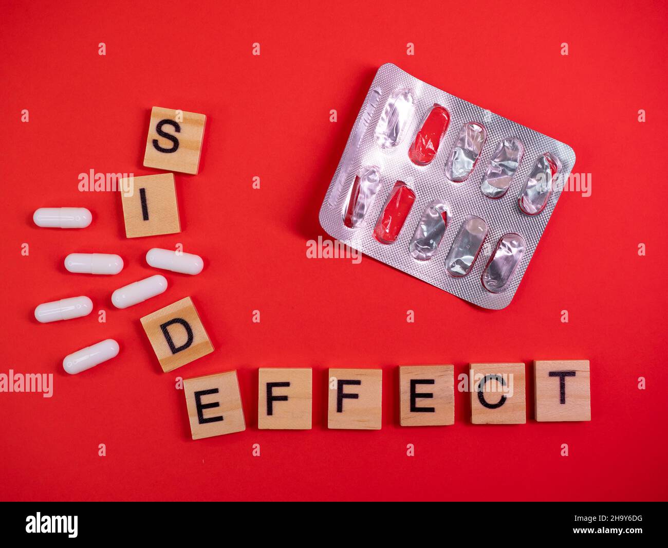 Words side effect on colored red paper texture background. Concept ...