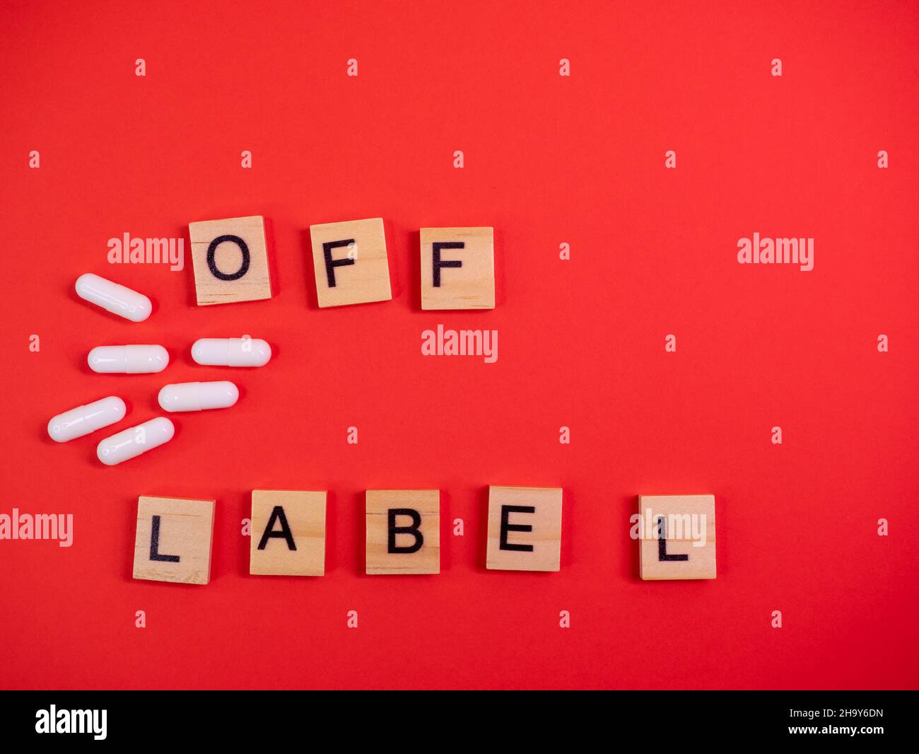 Off label approved medicine pill use. Covid-19 therapy. Words off label ...