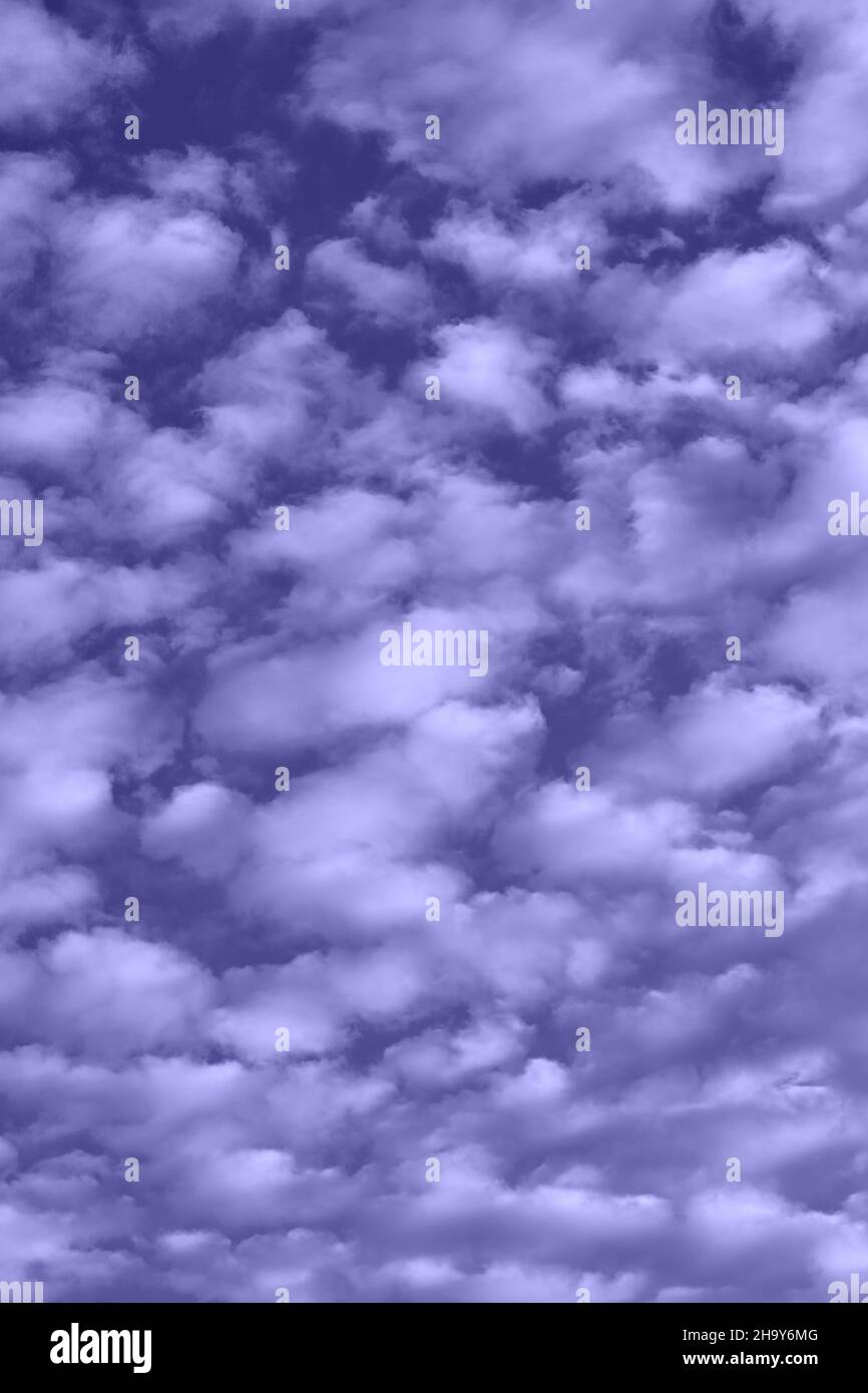 Sky with altocumulus clouds. Violet very peri color. Abstract ...