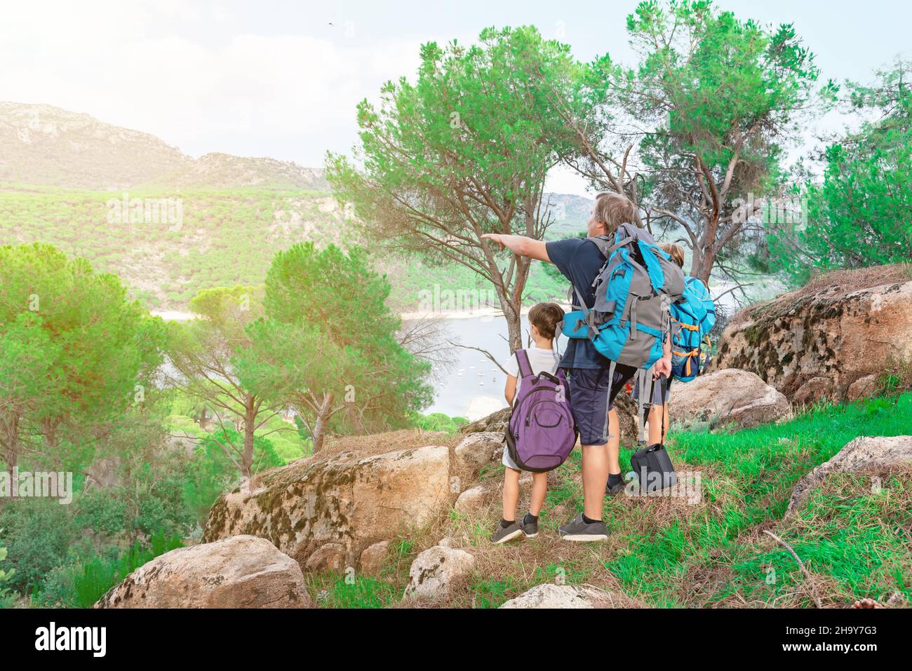 Boy scout monitor in the middle of the forest pointing out and ...