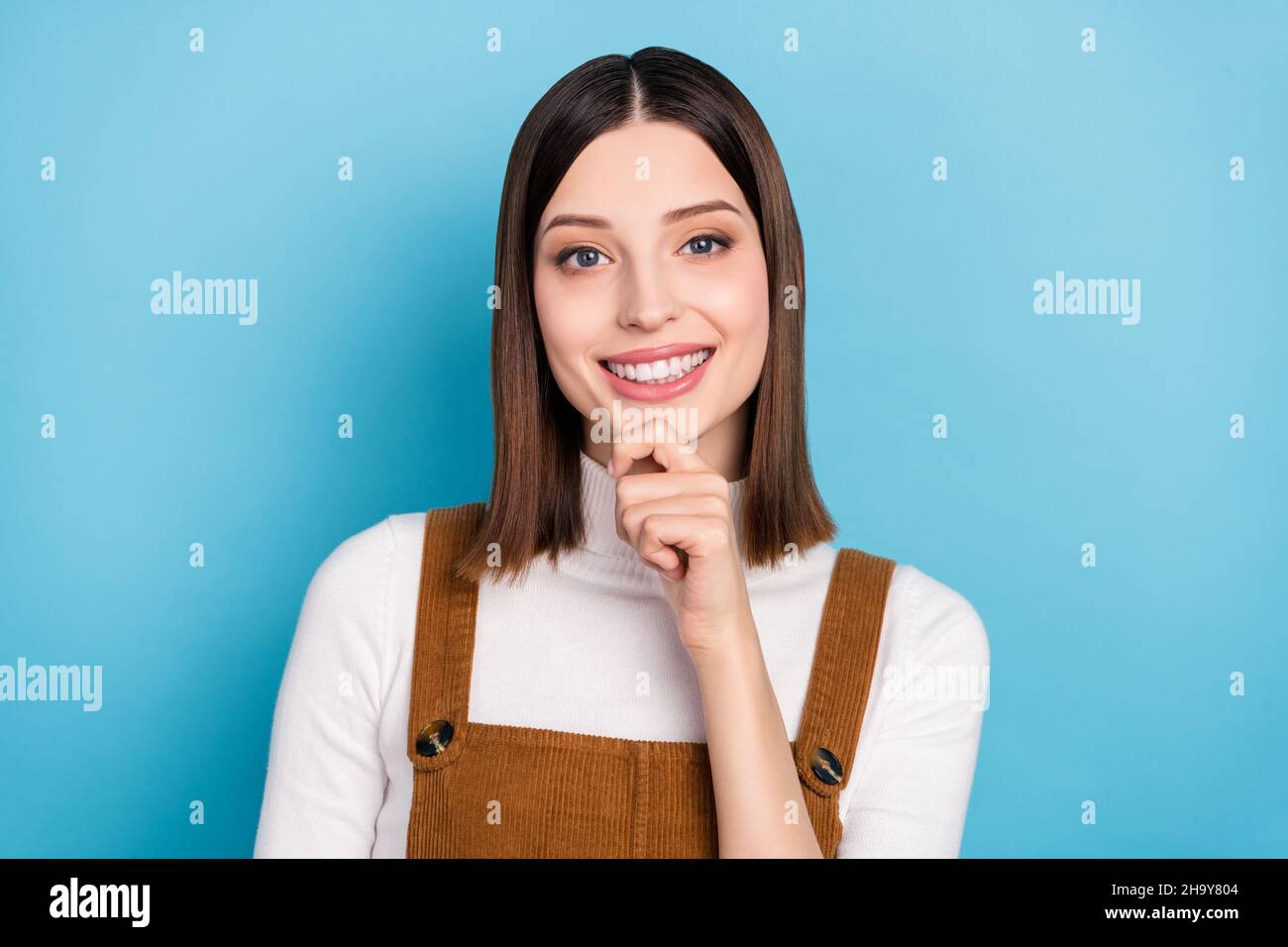 Photo of young lovely lady arm touch chin good mood confident smart isolated over blue color ...