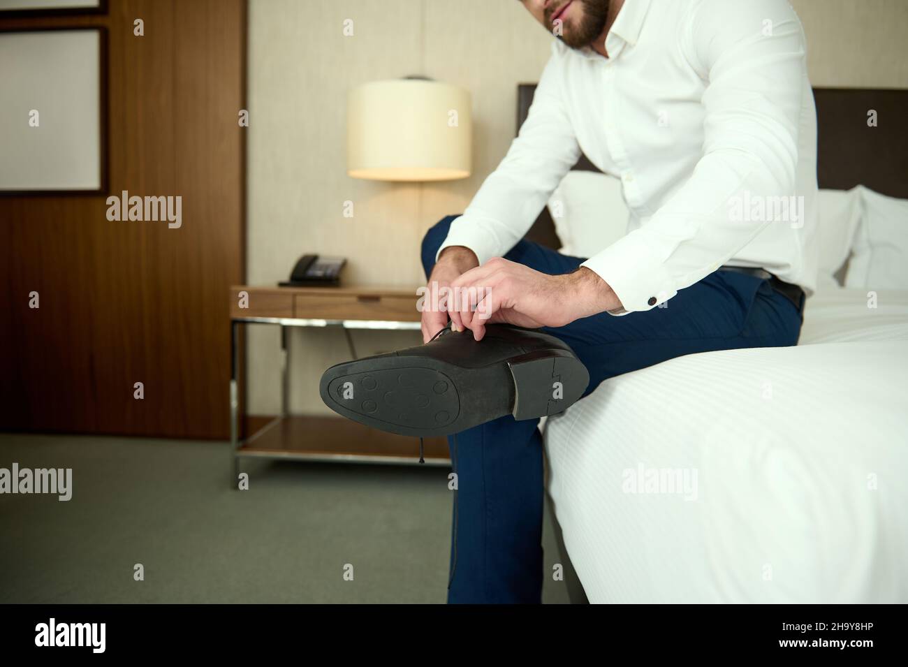 Man taking off his shoes hi-res stock photography and images - Alamy