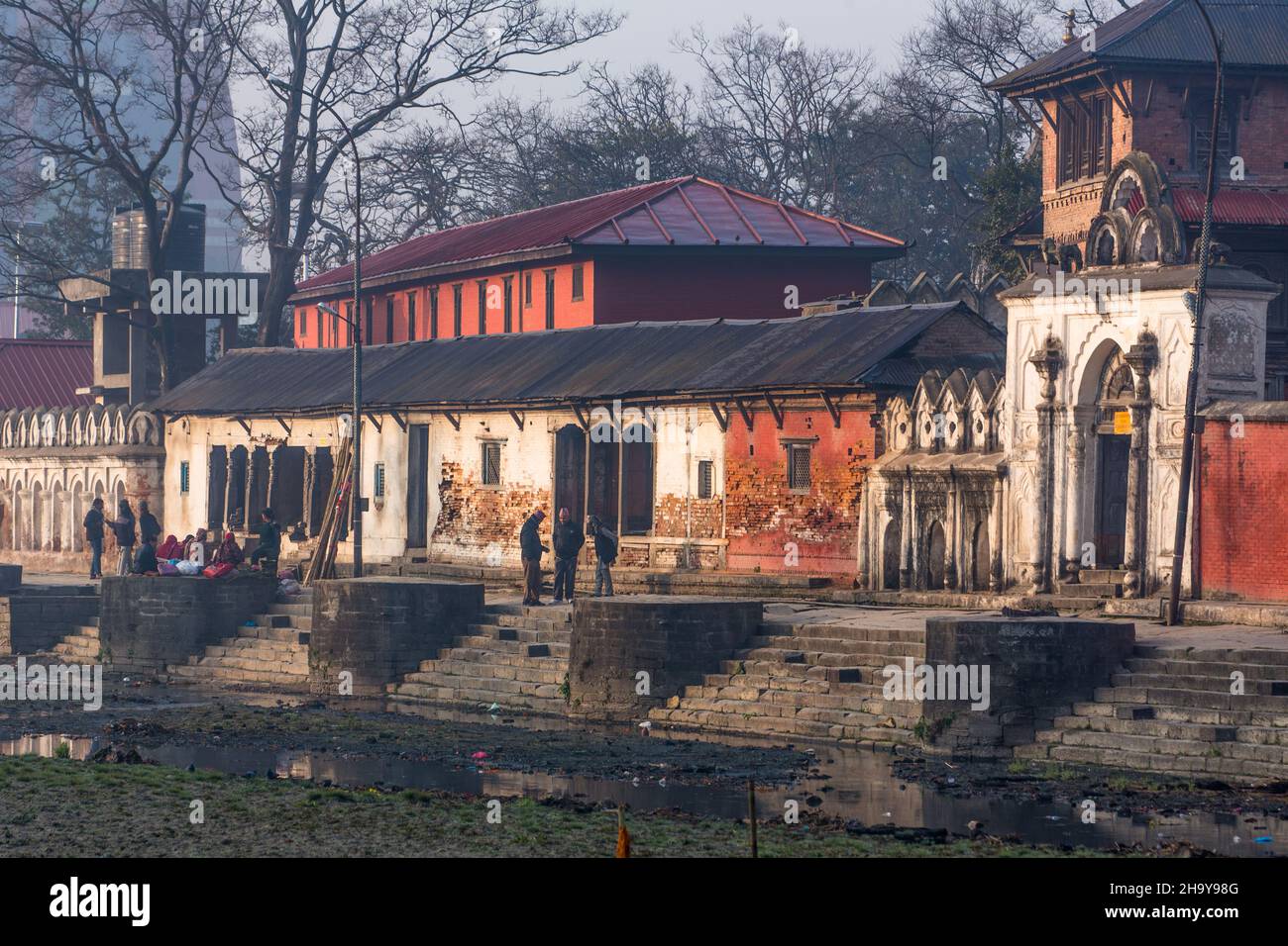 People across the very polluted Bagmati River in the Pashupatinath ...