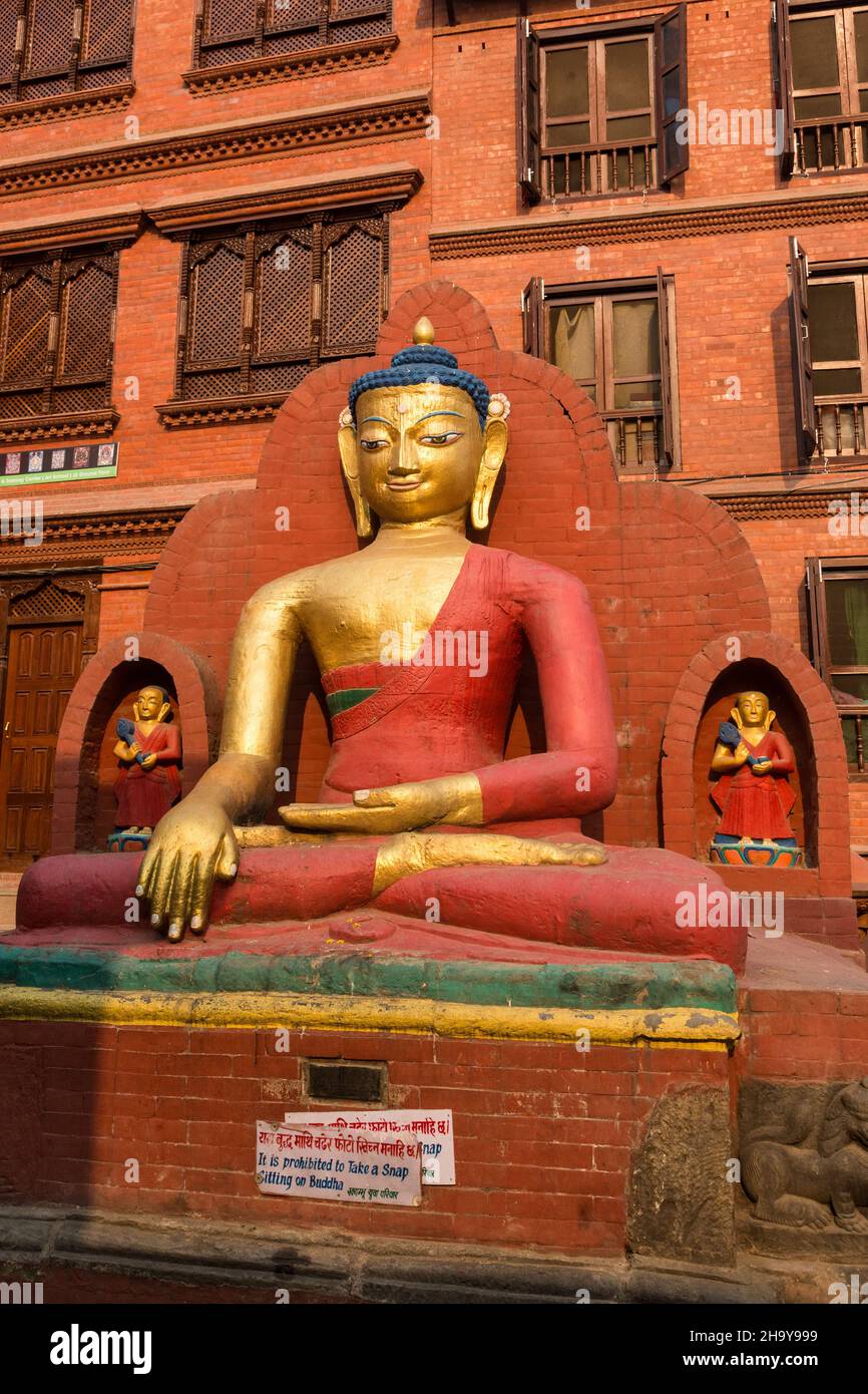 A statue of Buddha in the Swayambhunath temple complex in Kathmandu ...