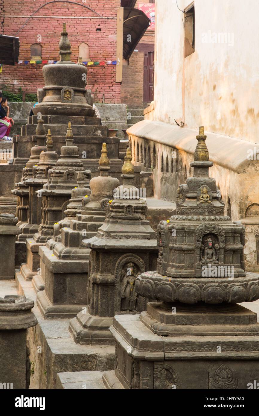 A row of carved stone chaityas with the Dhyani Buddhas in the ...