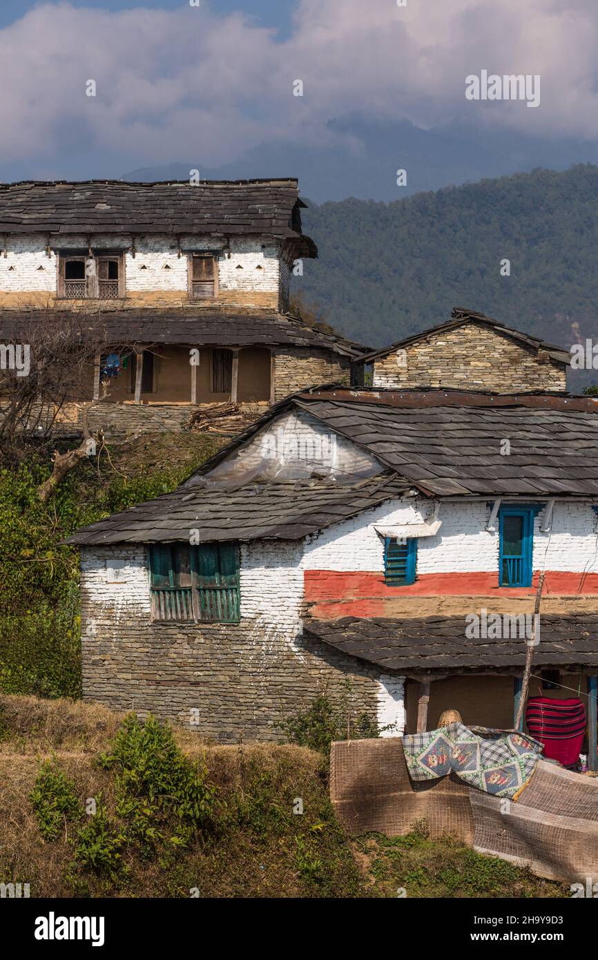 Traditional stone farm houses with slate tile roofs in the Himalayan ...