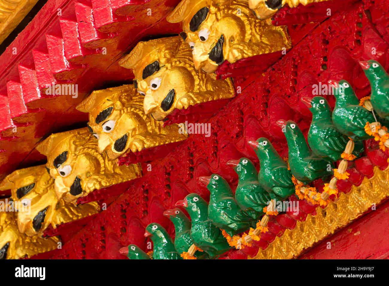 Detail of the painted wood carvings under the eaves of the Shesh ...