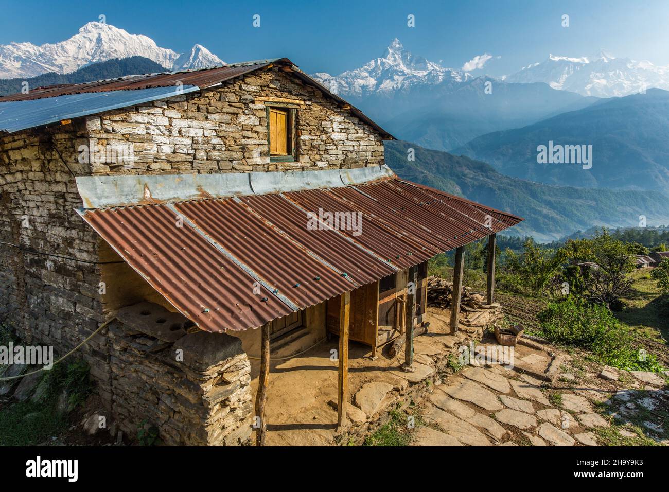 A traditional Nepalese farm house in the Himalayan foothill village of ...