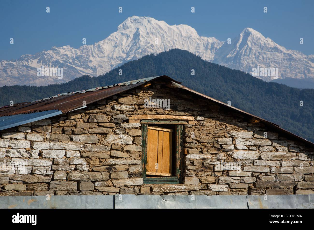 A traditional Nepalese farm house in the Himalayan foothill village of ...