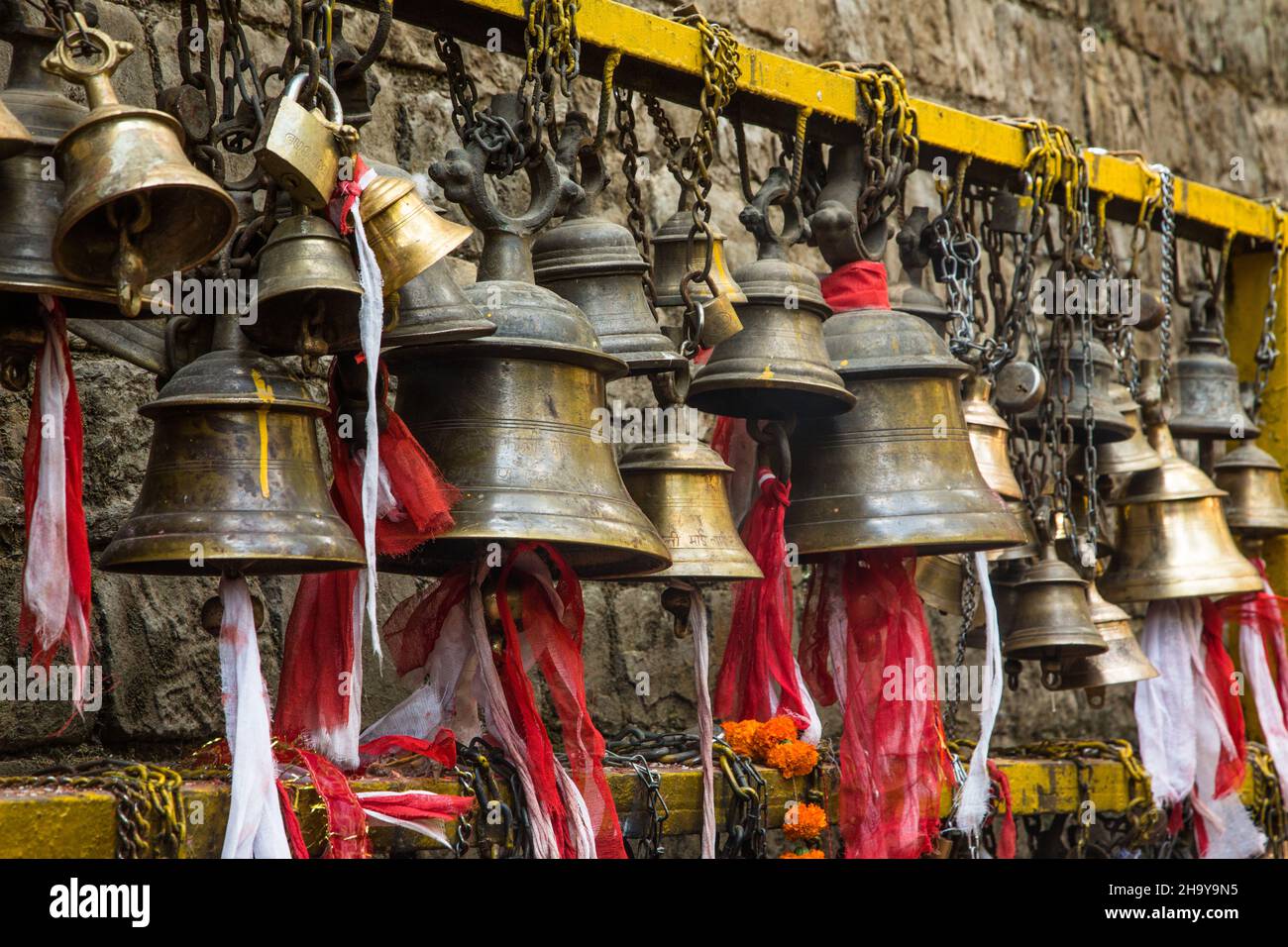 A row of temple bells at the Dakshinkali Temple, a Hindu temple near ...