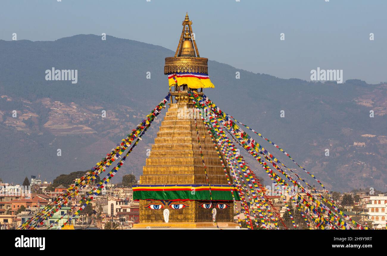 The harmika tower & spire of the Boudhanath Stupa with prayer flags ...