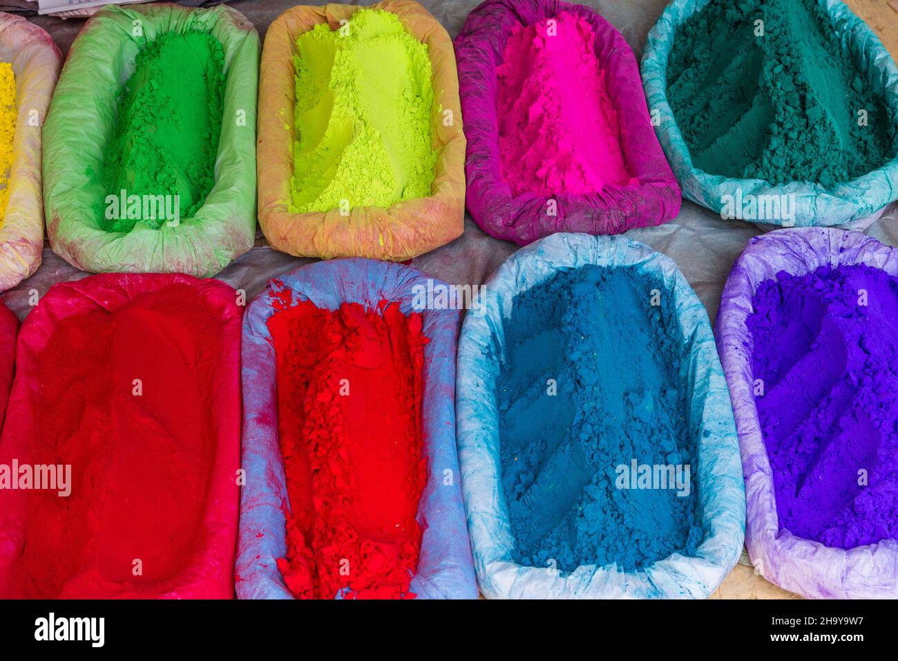 Colored powder called gulal is used in Hindu rituals, such as placing ...