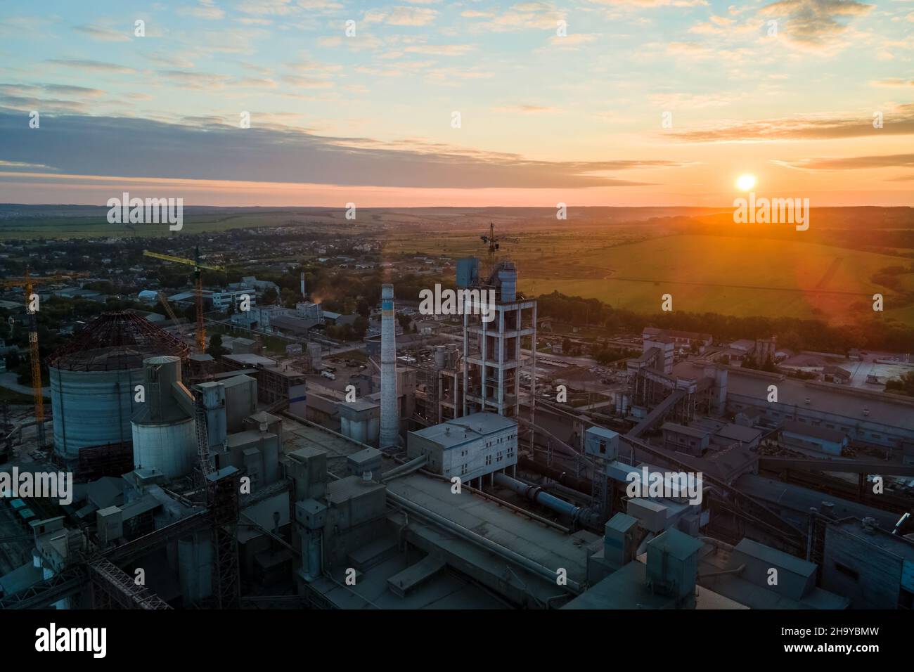 Aerial view of cement factory tower with high concrete plant structure ...