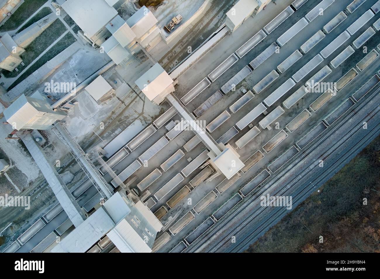 Aerial view of cargo train loaded with crushed stone materials at ...
