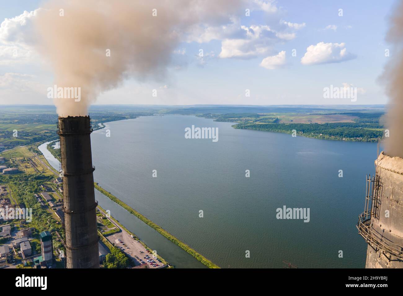 Aerial view of coal power plant high pipes with black smokestack ...