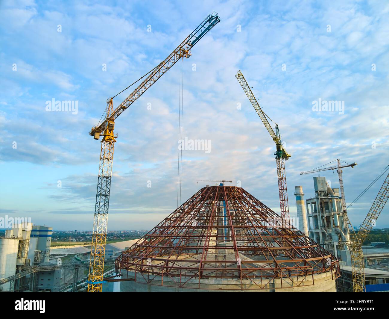 Aerial view of cement factory under construction with high concrete ...