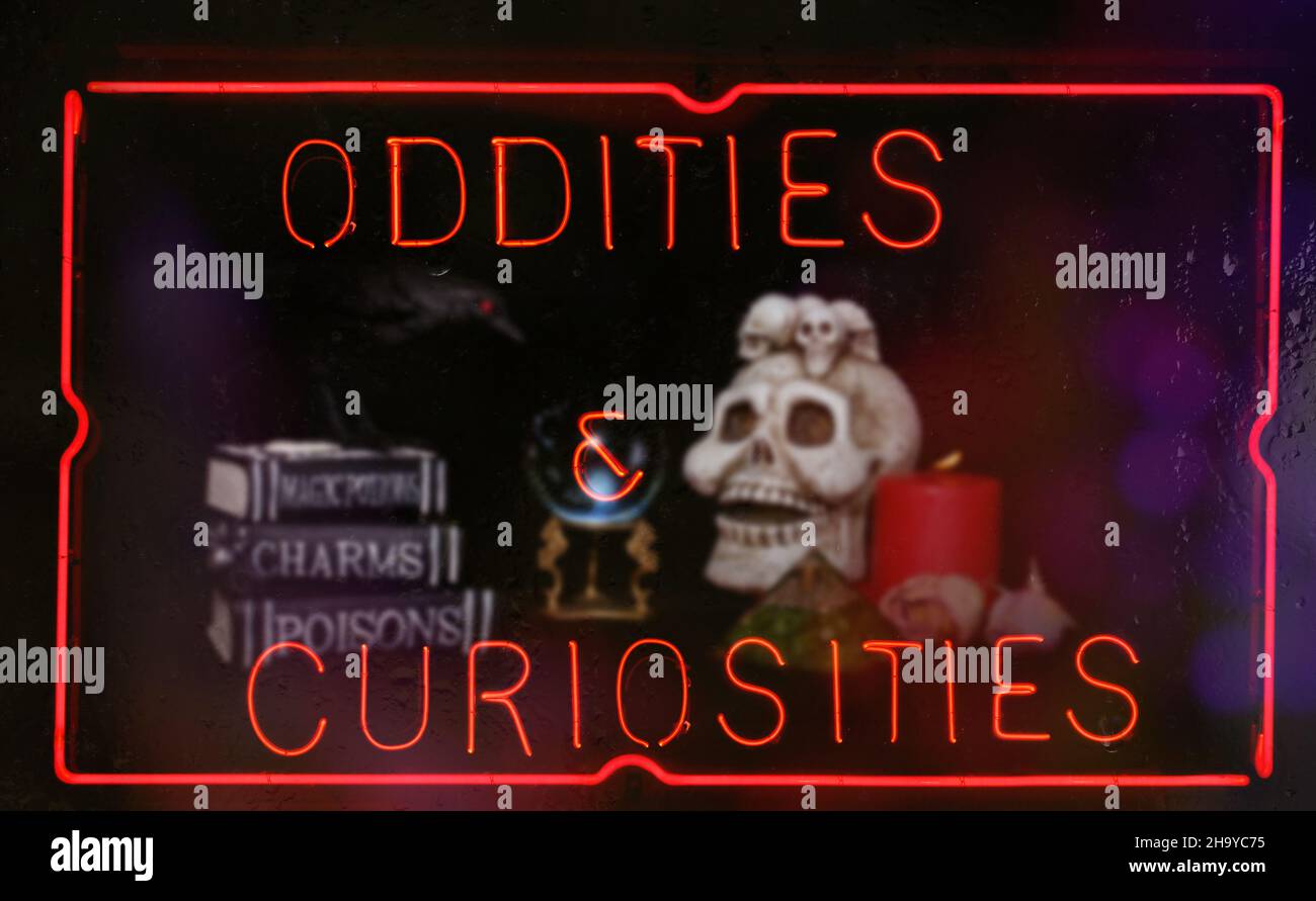 Oddities and Curiosities Neon Sign in Rainy Shop Window Stock Photo - Alamy