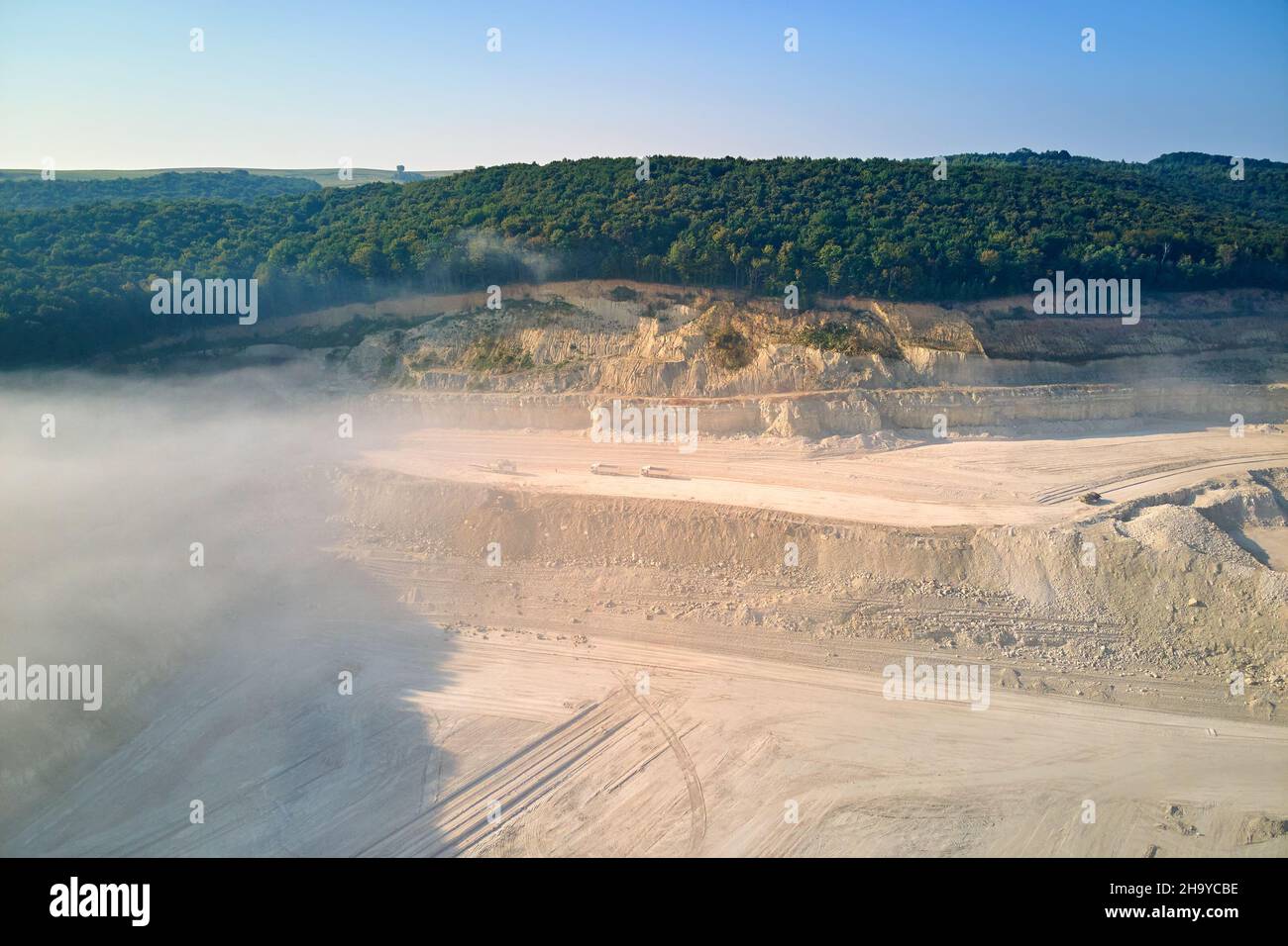 Aerial view of open pit mining site of limestone materials extraction ...