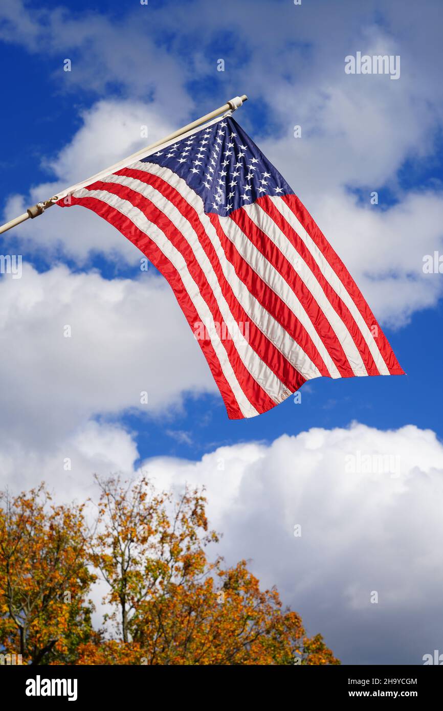 American flag of the United States of America floating in the sky on a ...