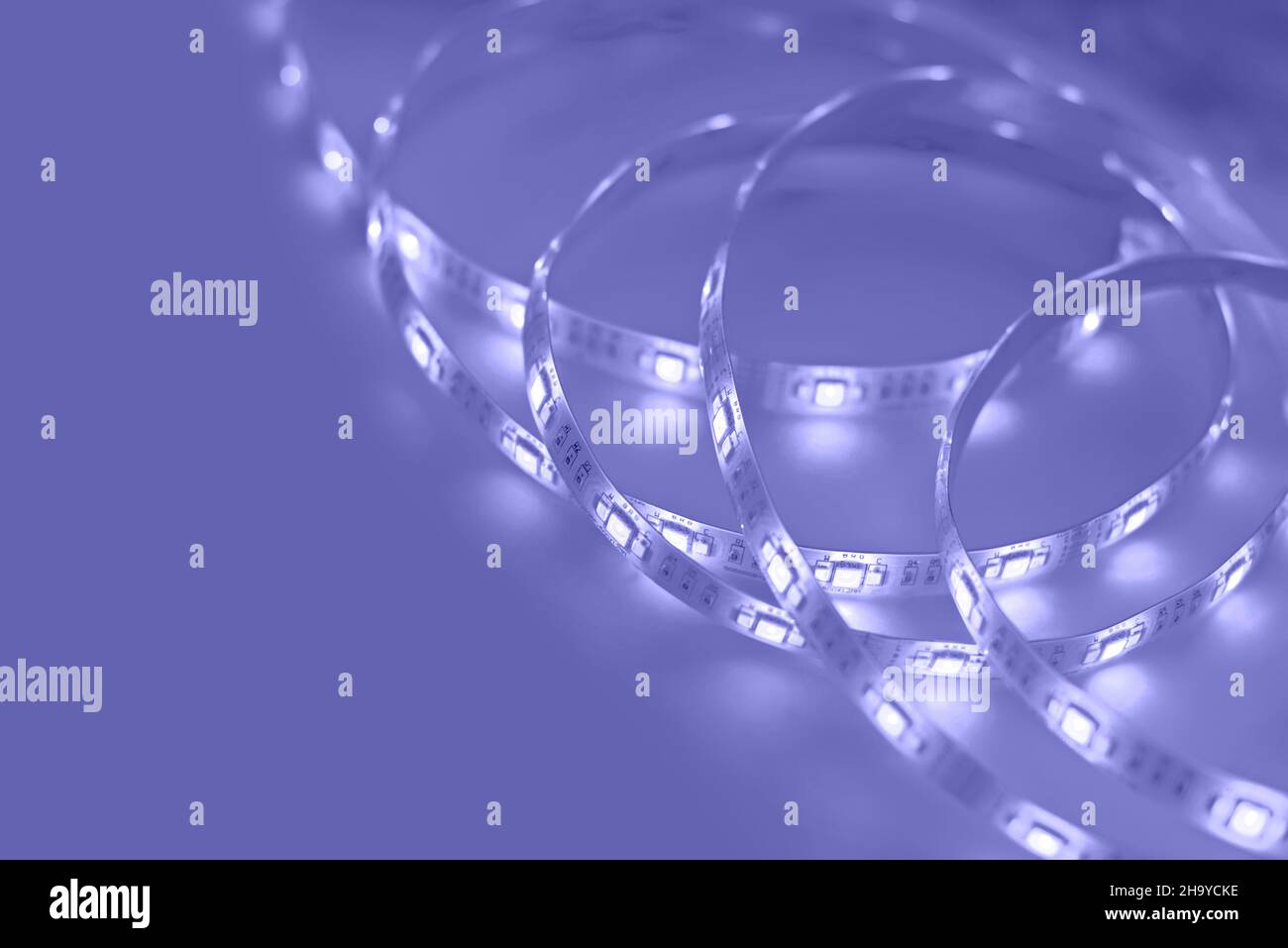 Bright neon LED strip glows lavender purple color Stock Photo - Alamy