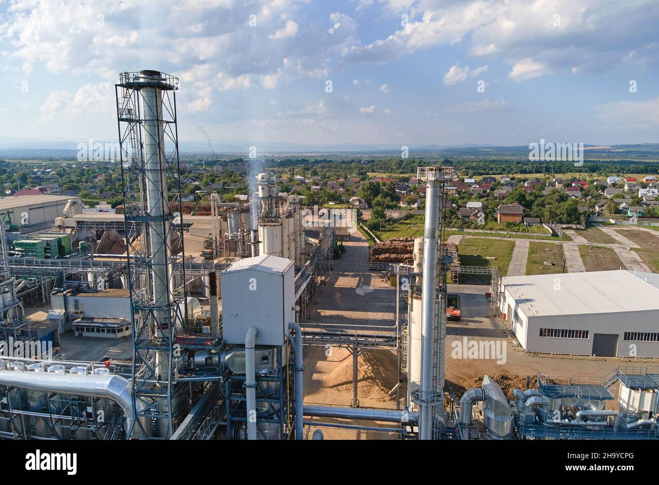 Aerial view of wood processing factory with stacks of lumber at plant ...
