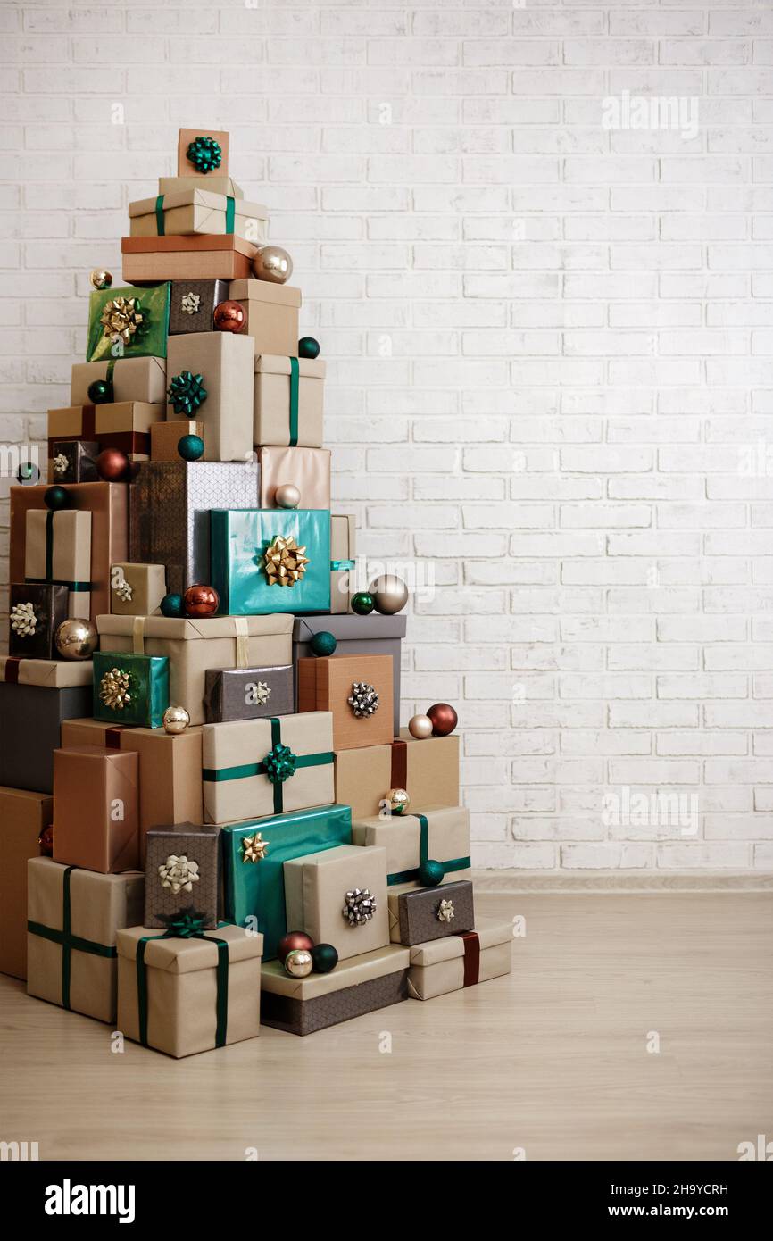 Christmas gift boxes laid out in the shape of a Christmas tree over ...