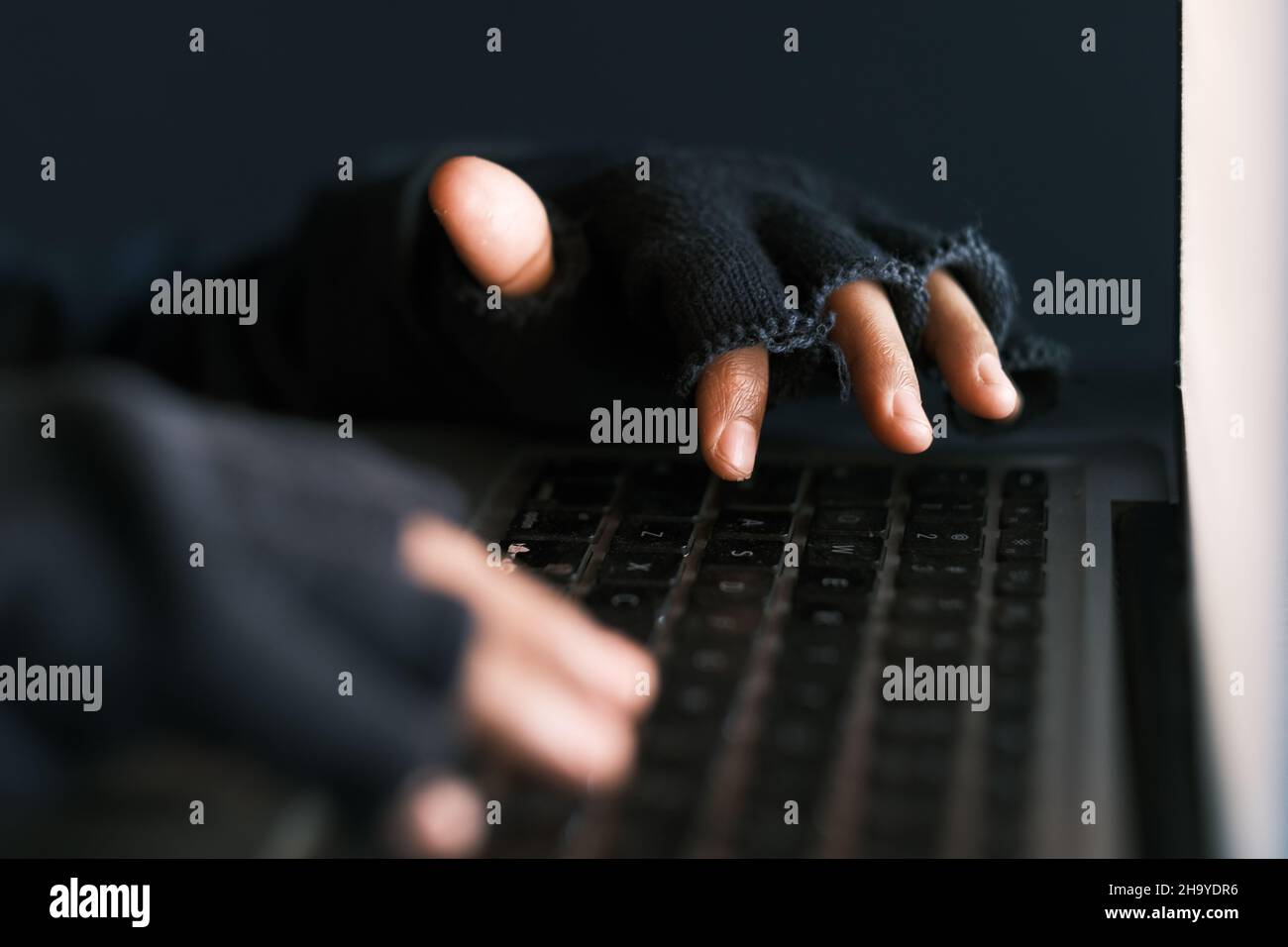 hacker hand stealing data from laptop top down Stock Photo - Alamy