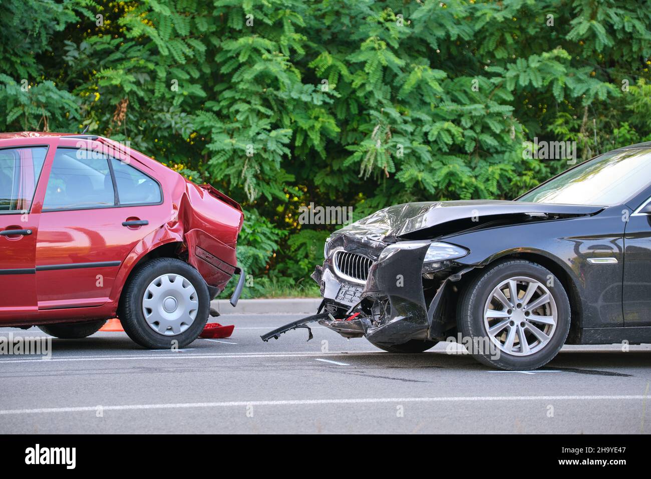 Damaged in heavy car accident vehicles after collision on city street ...