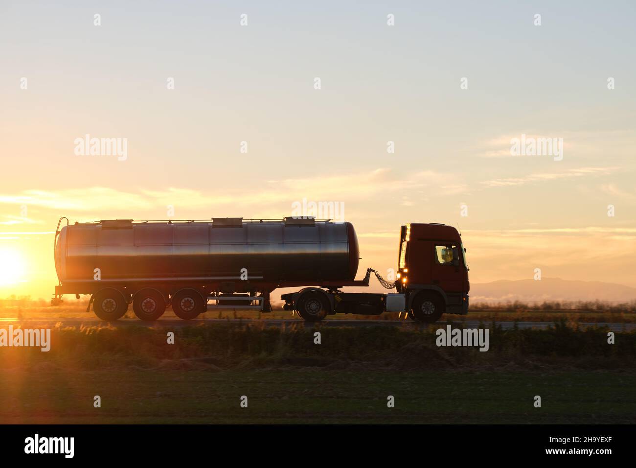 Petrol cargo truck driving on highway hauling oil products. Delivery ...