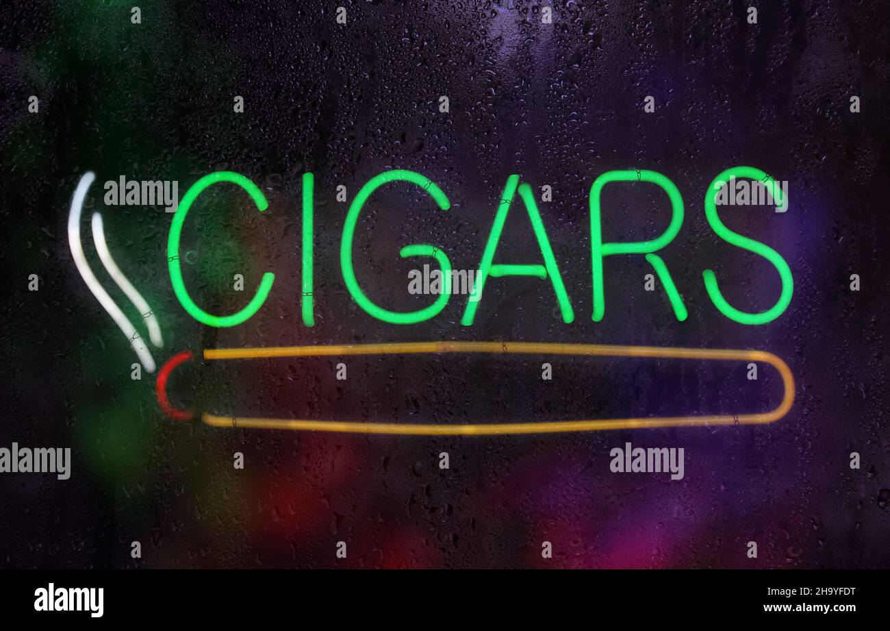 Vintage Neon Cigar Sign in Wet Rainy Window Stock Photo - Alamy