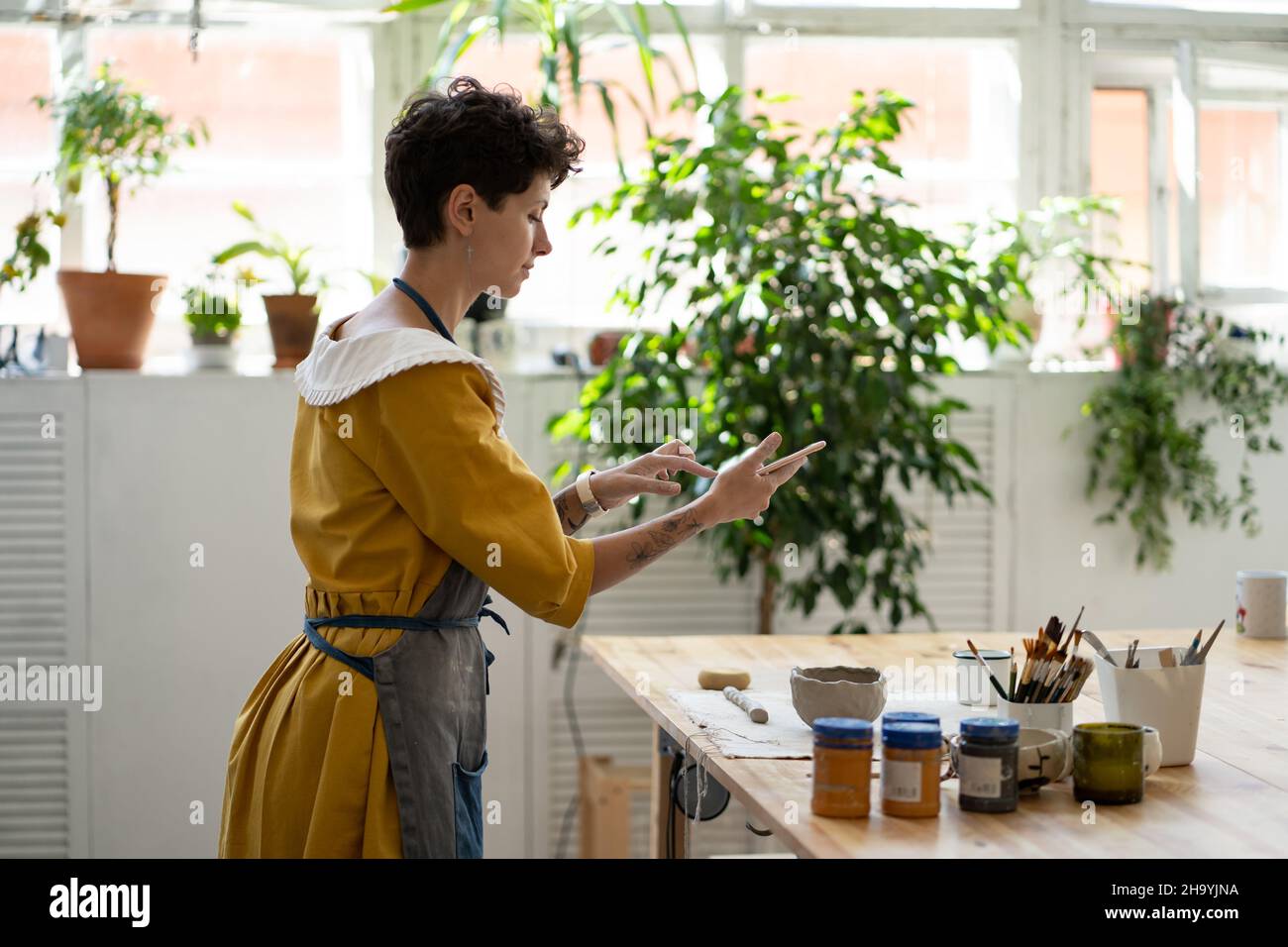 Girl artist make video of process in pottery studio of online master ...