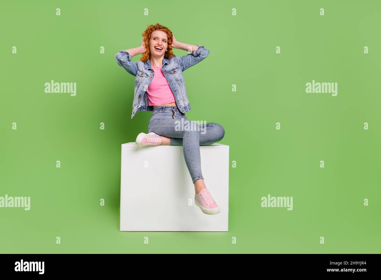 Full length photo of young girl happy positive smile hand touch ginger ...