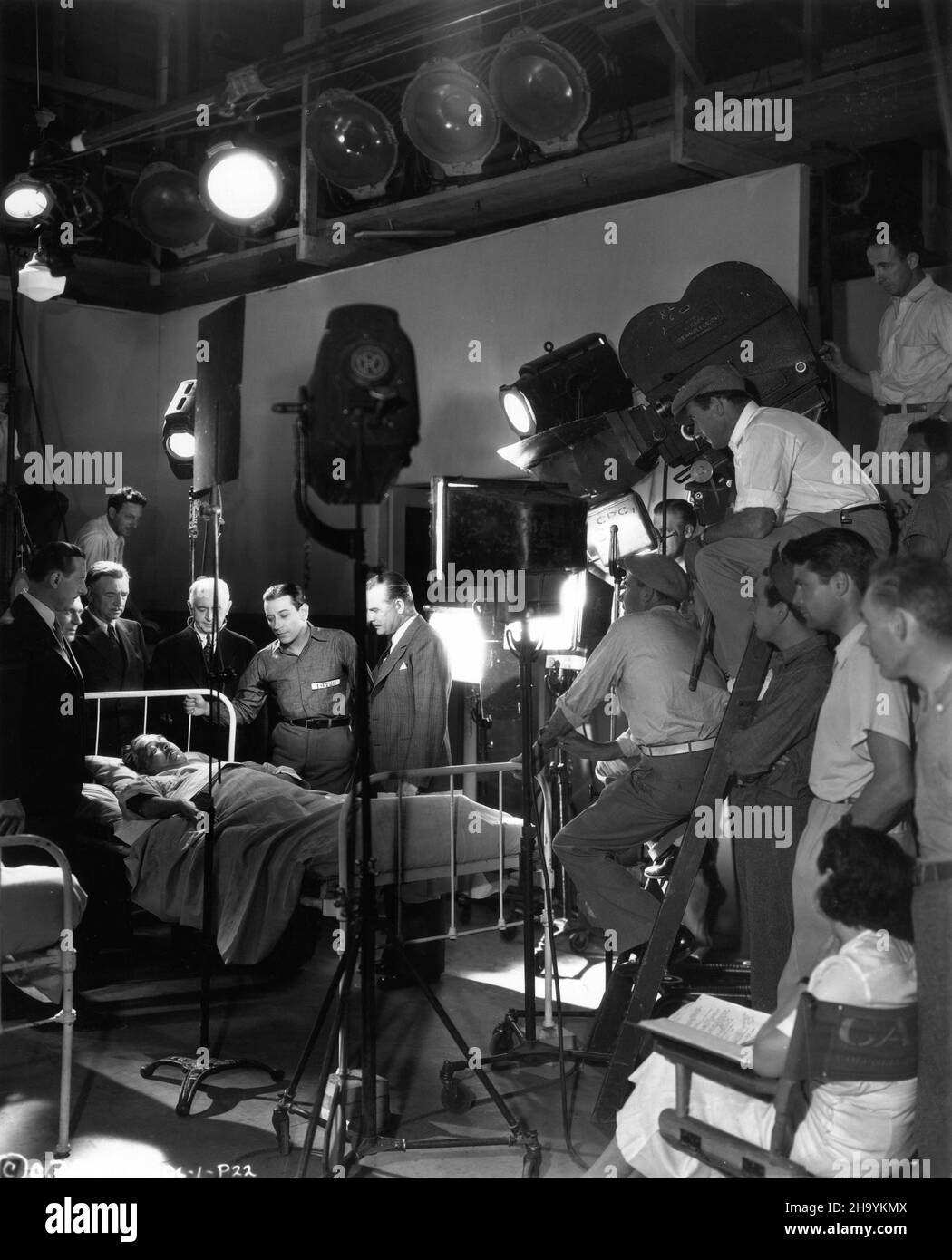 GEORGE RAFT and WALTER CONNOLLY (in prison hospital bed) on set candid ...