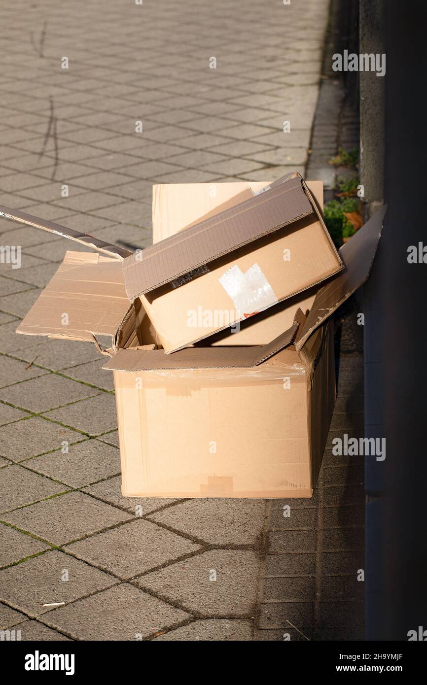 Cardboard packages on the sidewalk of one of the city streets Stock ...