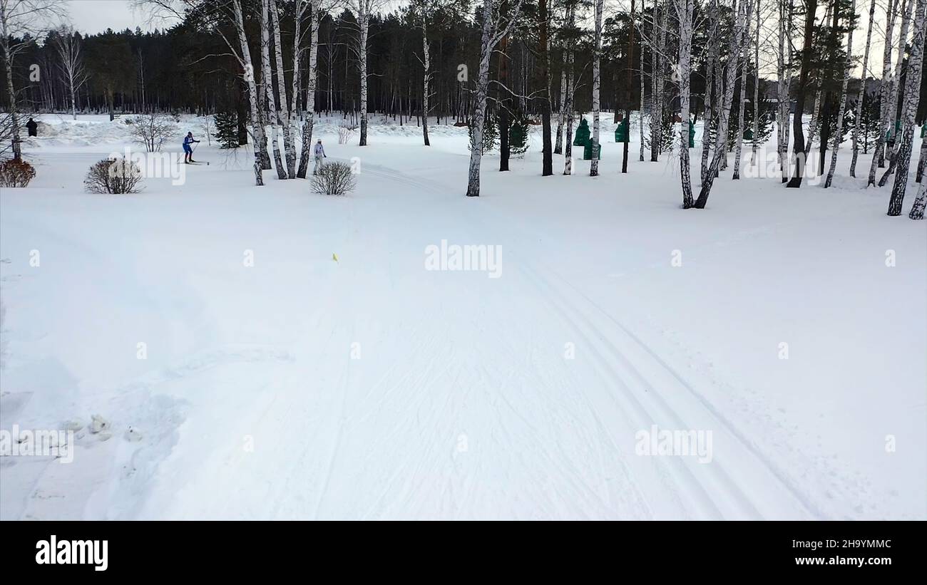 Ski race on track in winter. Footage. Top view of competing ...