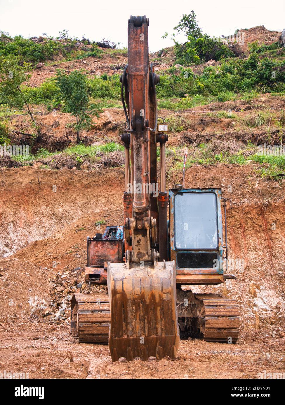 excavator - front facing view at the site Stock Photo - Alamy