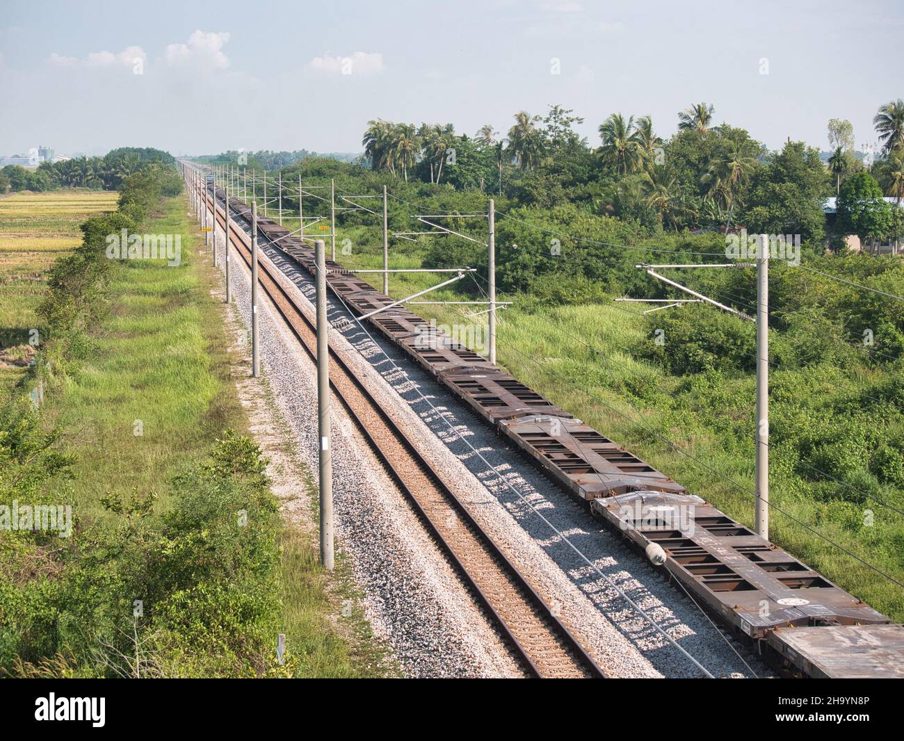 Empty train freight platform carriage on the track Stock Photo - Alamy
