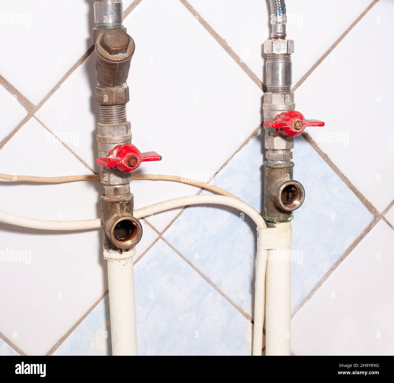 Old rusty pipes and plumbing fittings on water pipeline. Elimination of ...