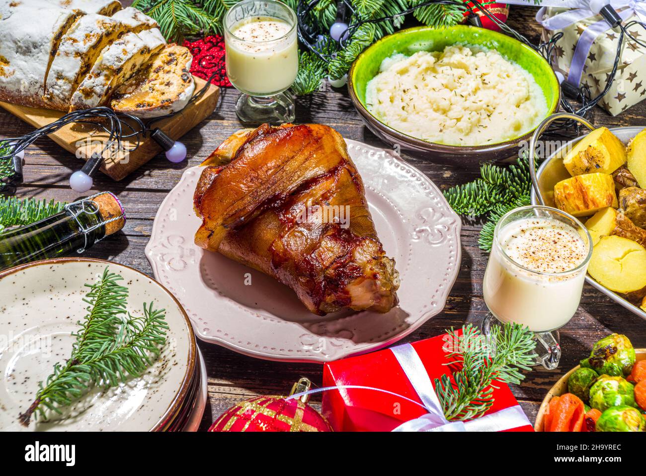Festive Christmas dinner table with traditional foods and dished ...
